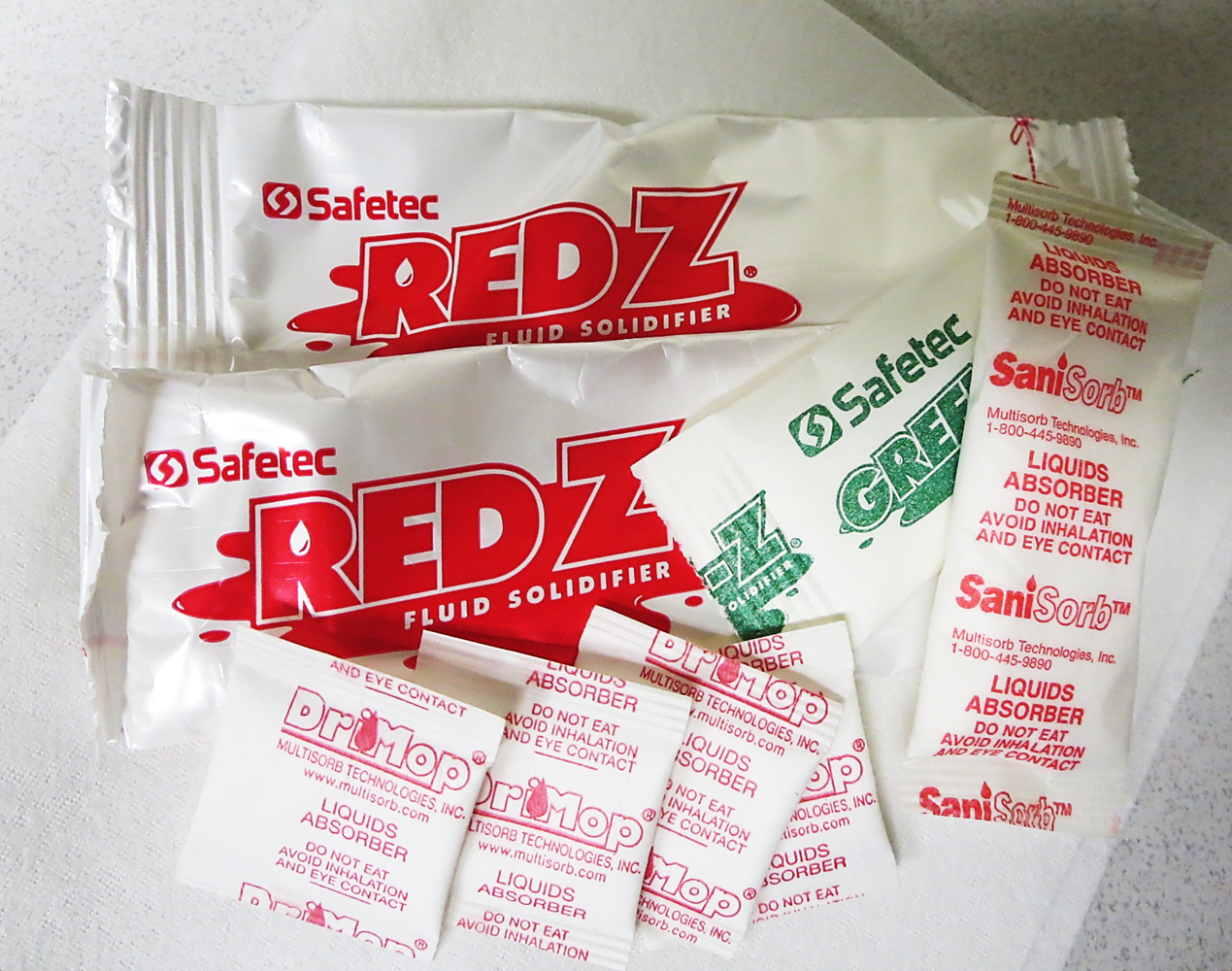 DOT CFR49 Compliant Spill Control Pouches & Sheets